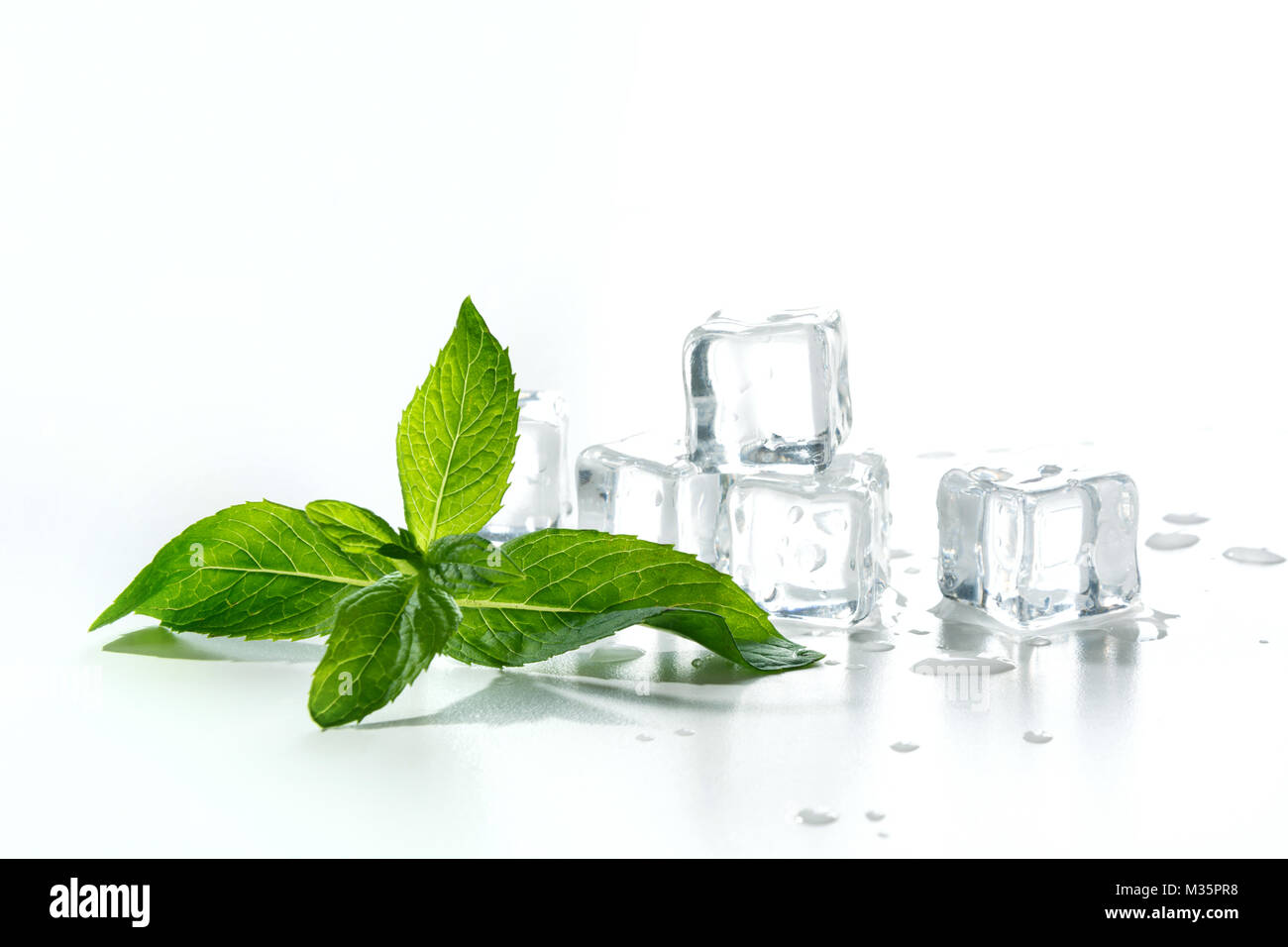 Ice with mint isolated on white Stock Photo - Alamy