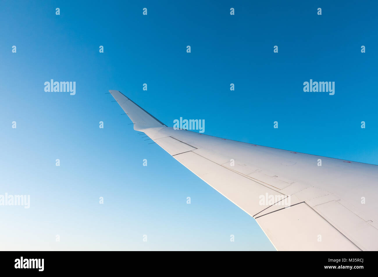 Looking through the window aircraft during flight a snow covered ...