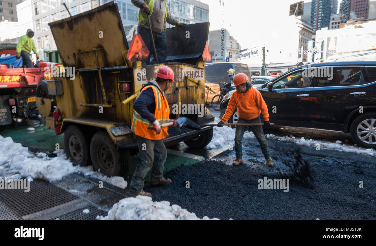 New York City, USA - March 17, 2017 - Road construction crew and ...