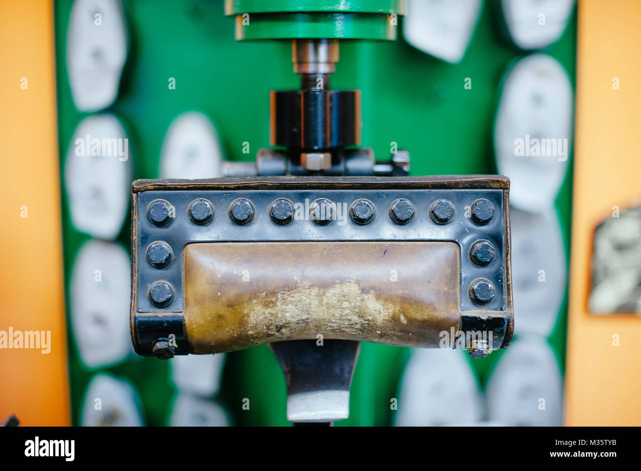 workshop shop shoemaker machine to reshoke shoes Stock Photo - Alamy