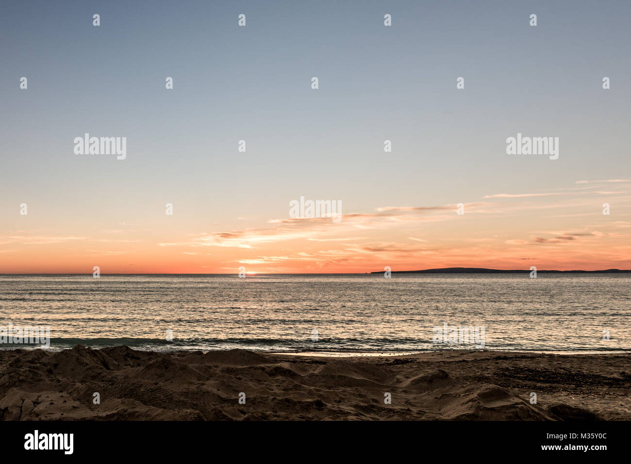 The sun setting at sunset seen from the beach of Palma in Palma de ...