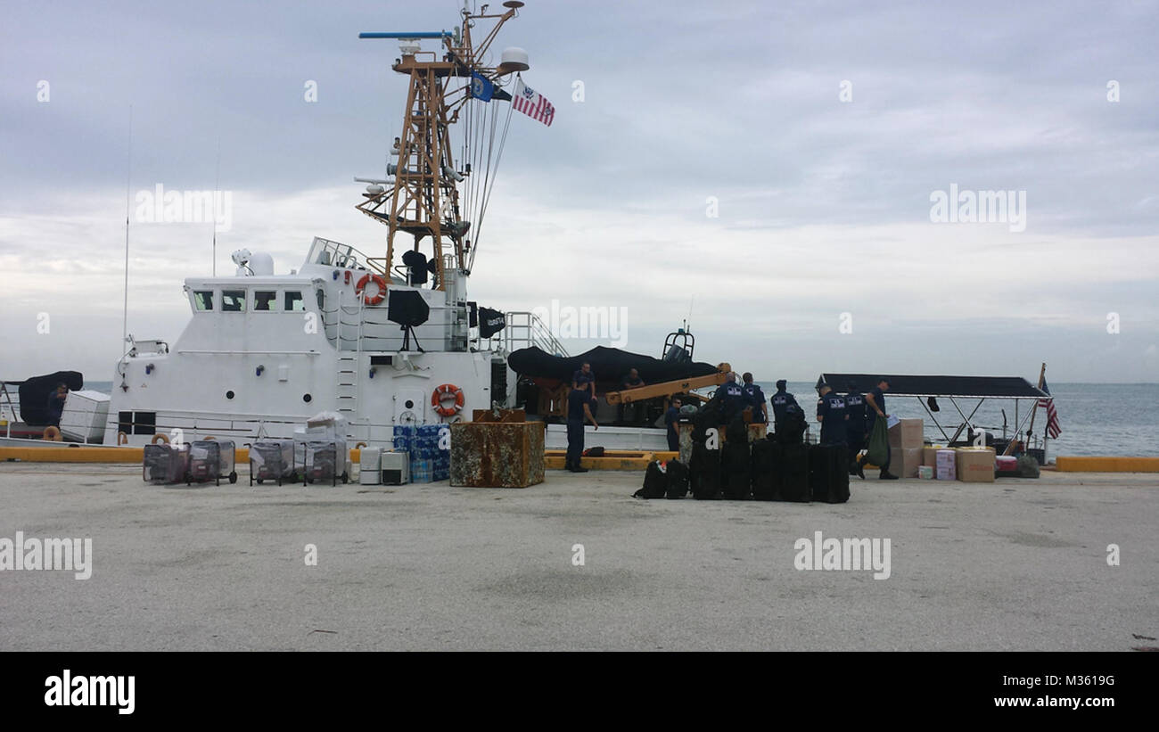 Coast Guard crews from the cutter Assateague and the Strike Team ...