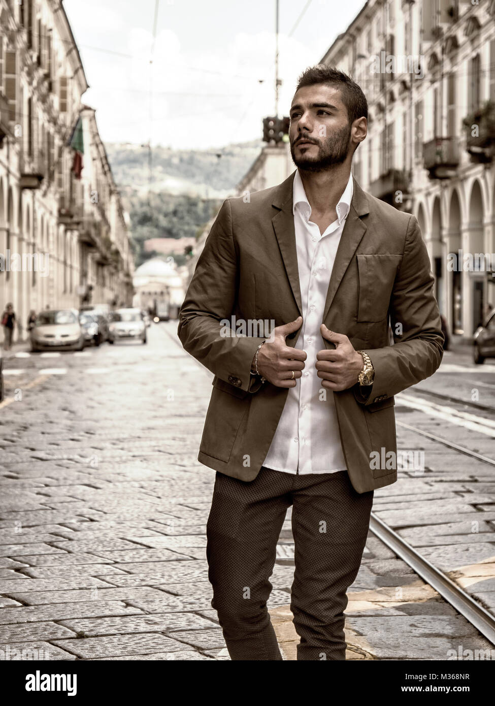 Attractive man outdoor wearing elegant jacket, in European city, Turin ...