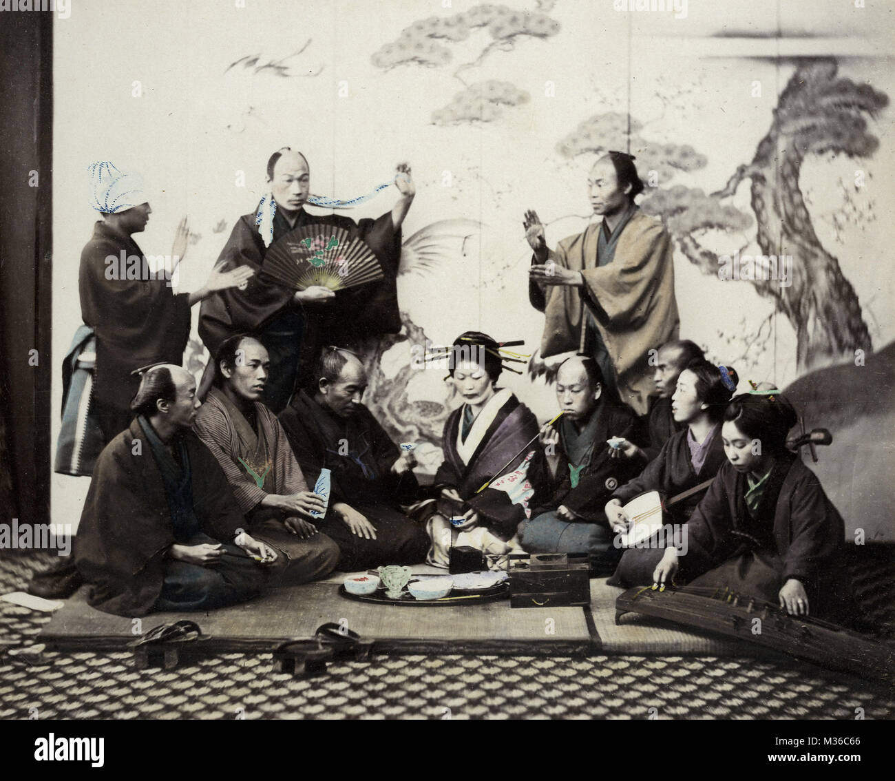1860's Japan - portrait of a group of men and women enjoying a social ...