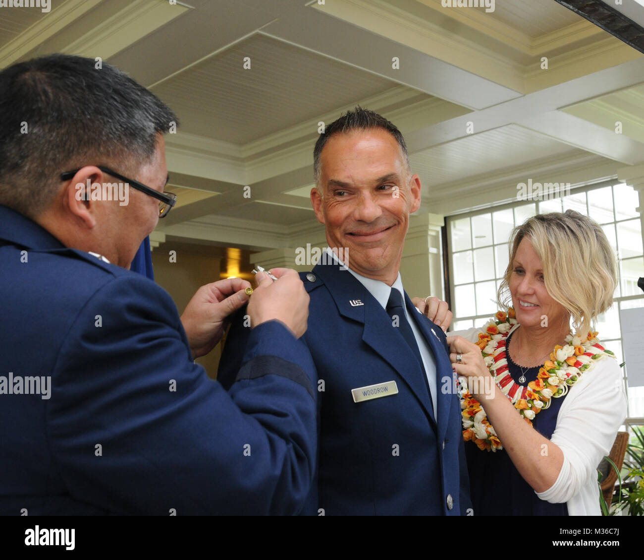 Air Force Brig. Gen. Gregory S. Woodrow is pinned on his new rank by ...