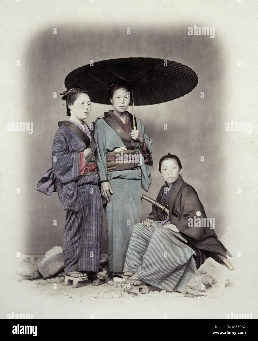 1860's Japan - portrait of two young woman and a young man Stock Photo ...