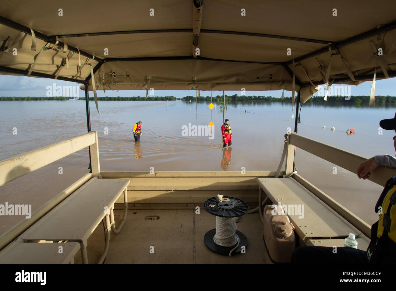 Texas Task Force 1 Urban Search and Rescue members help guide the LMTV ...