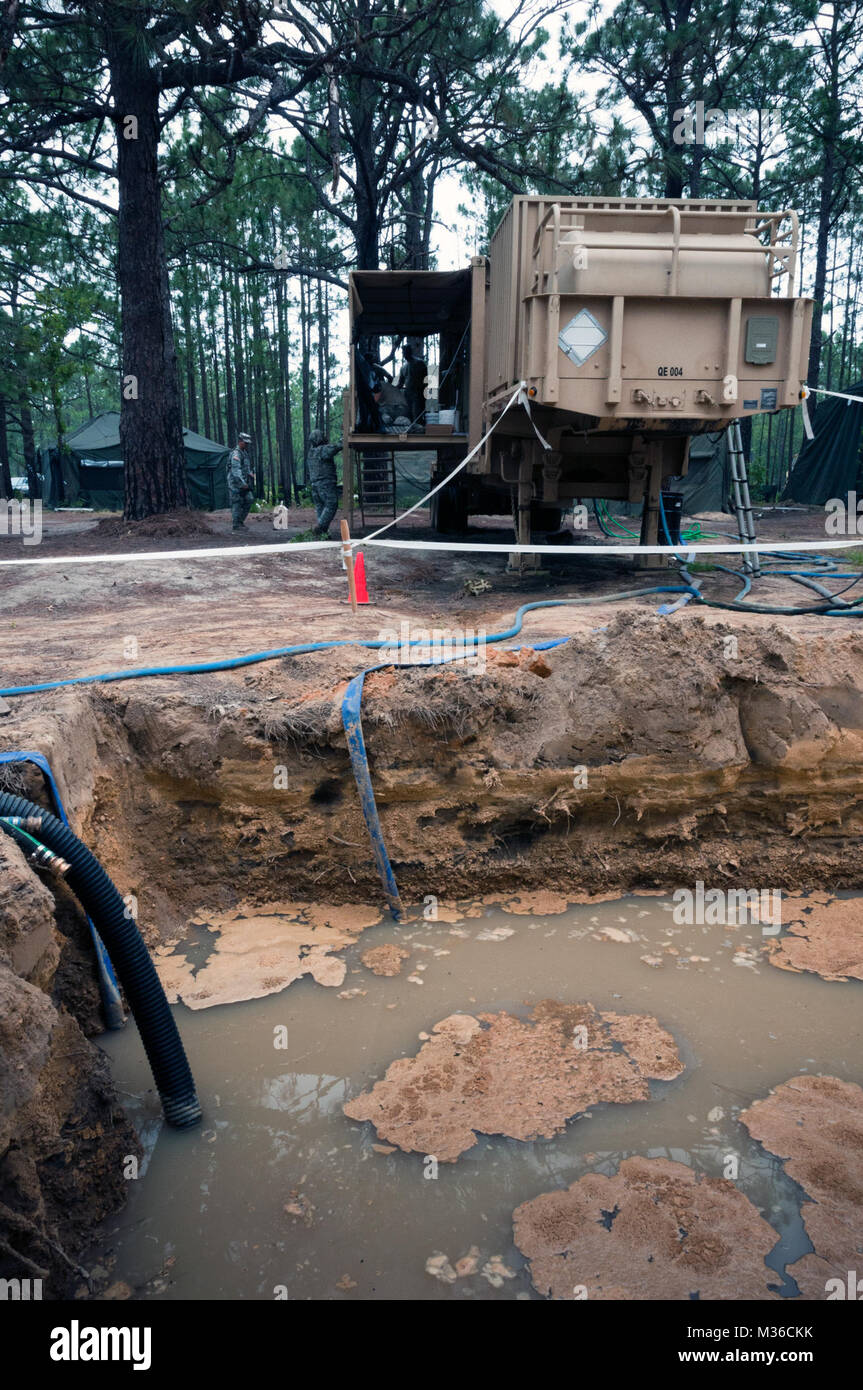 Murky water waits to be used by a Laundry and Bath System operated by ...