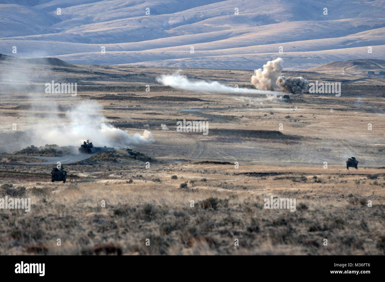 JGSDF tank and U.S. Army Strykers participate in a live-fire exercise ...