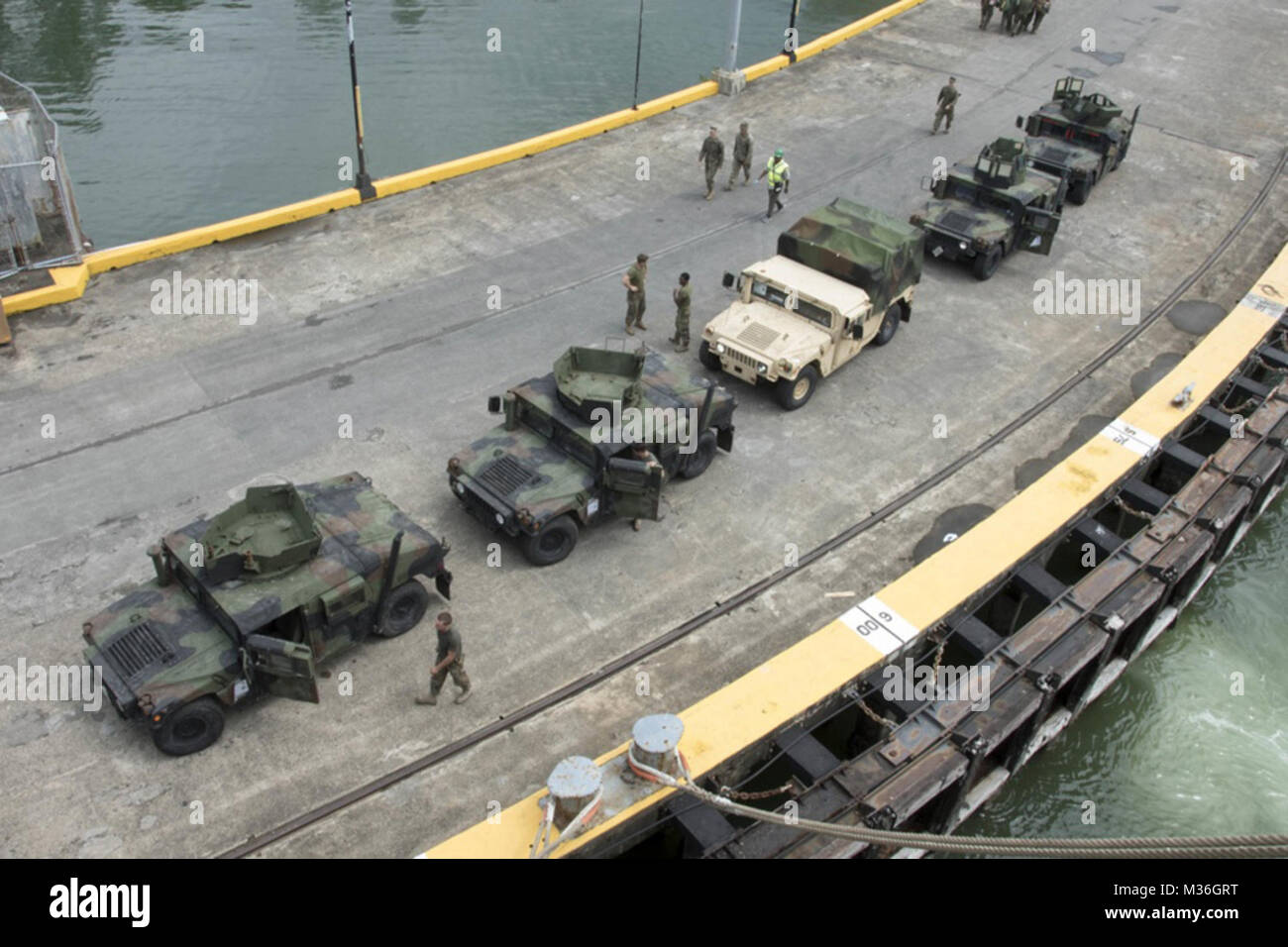 U.S. Marines load equipment back on ship after completing Amphibious ...