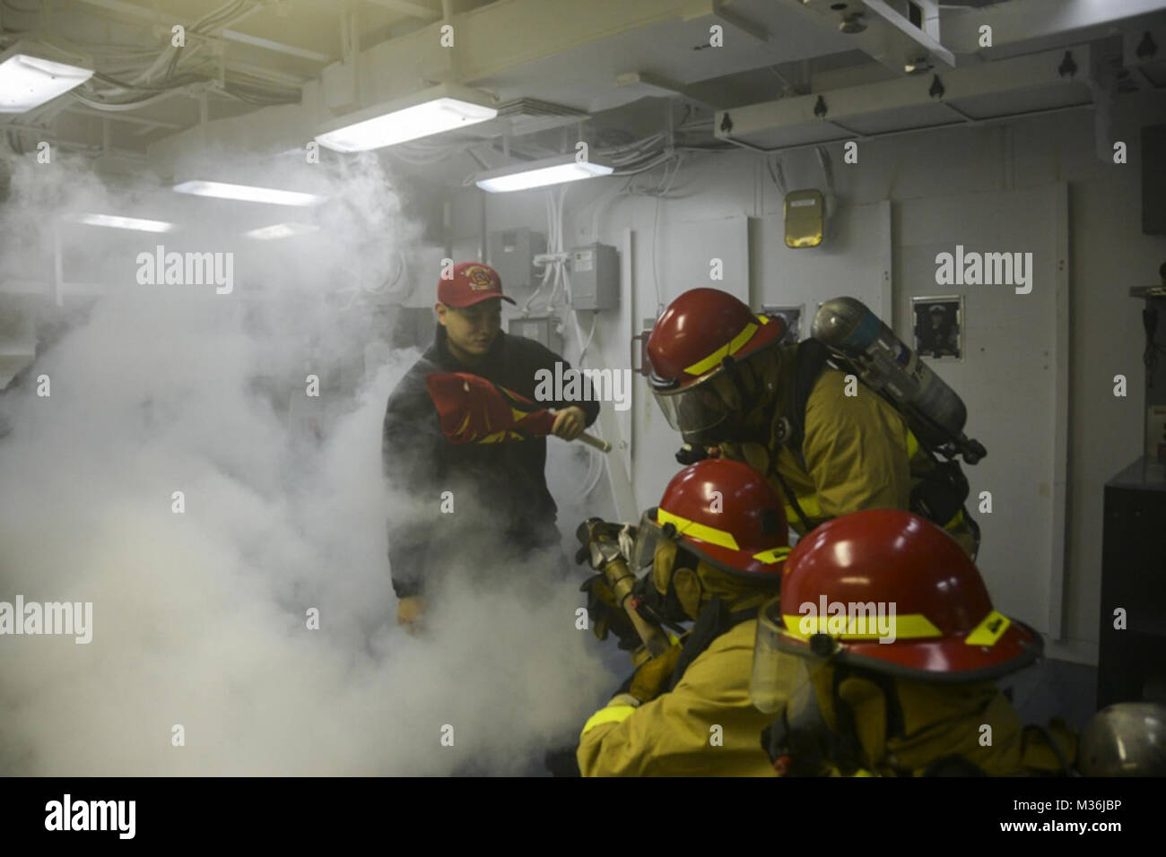 Sailors participate simulated fire drill aboard USS Ronald Reagan by # ...