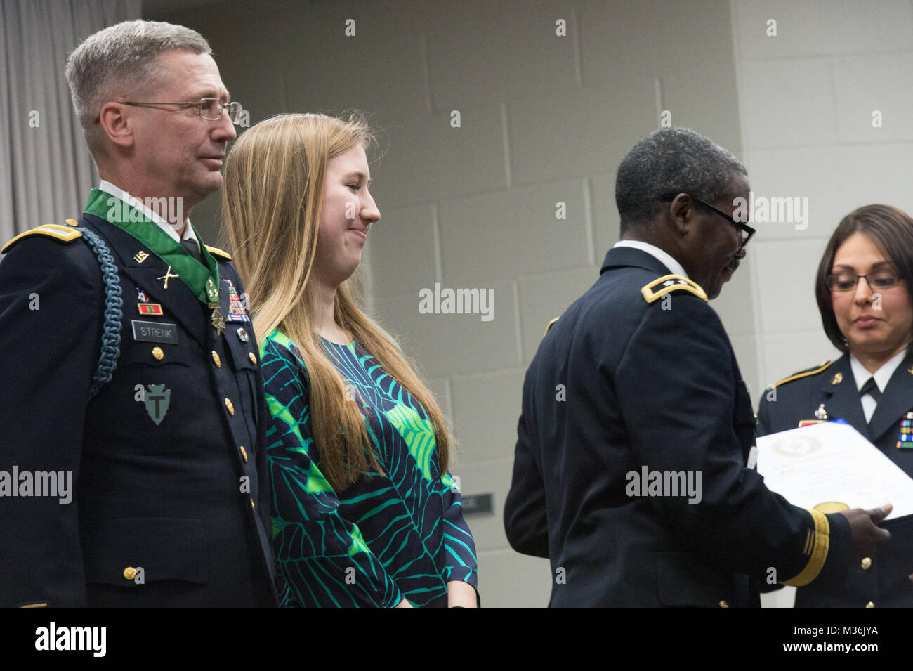 Col. Joachim Strenk stands with daughter Jessie Strenk for the ...