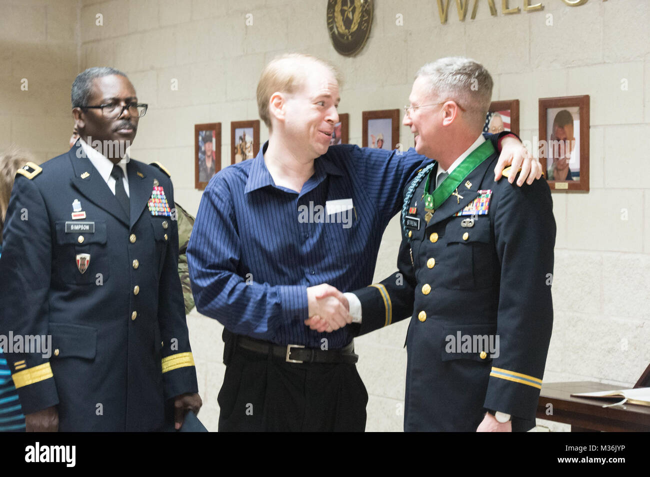 Friends, family and colleagues congratulate Col. Joachim Strenk at his ...