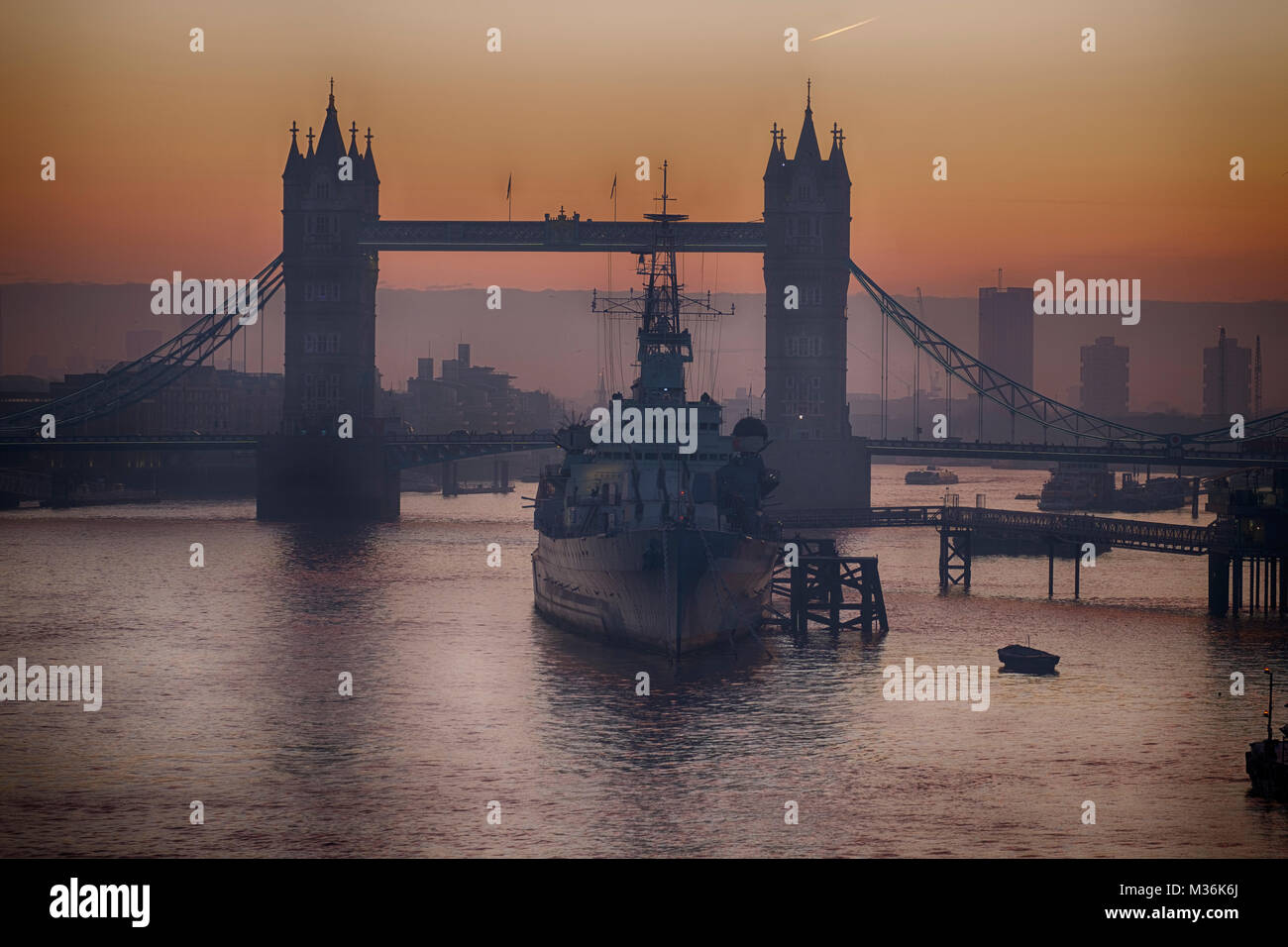 Tower Bridge and HMS Belfast at dawn, London, UK Stock Photo - Alamy