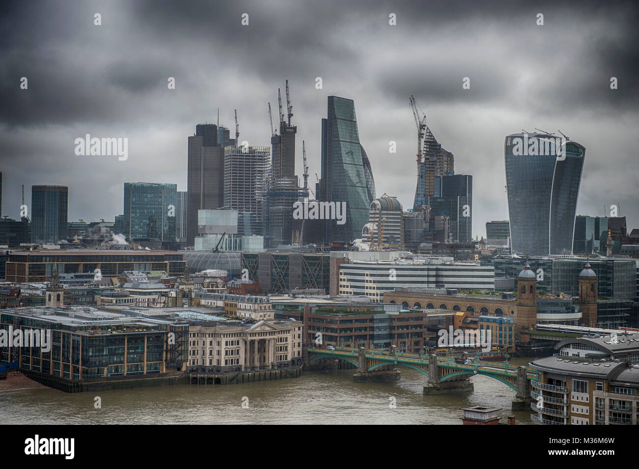 Dramatic London skyline on a grey winter day with skyscraper buildings ...