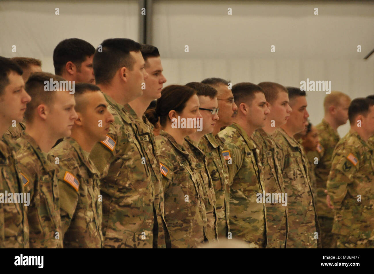 Members of the 77th Combat Aviation Brigade stand in formation ...