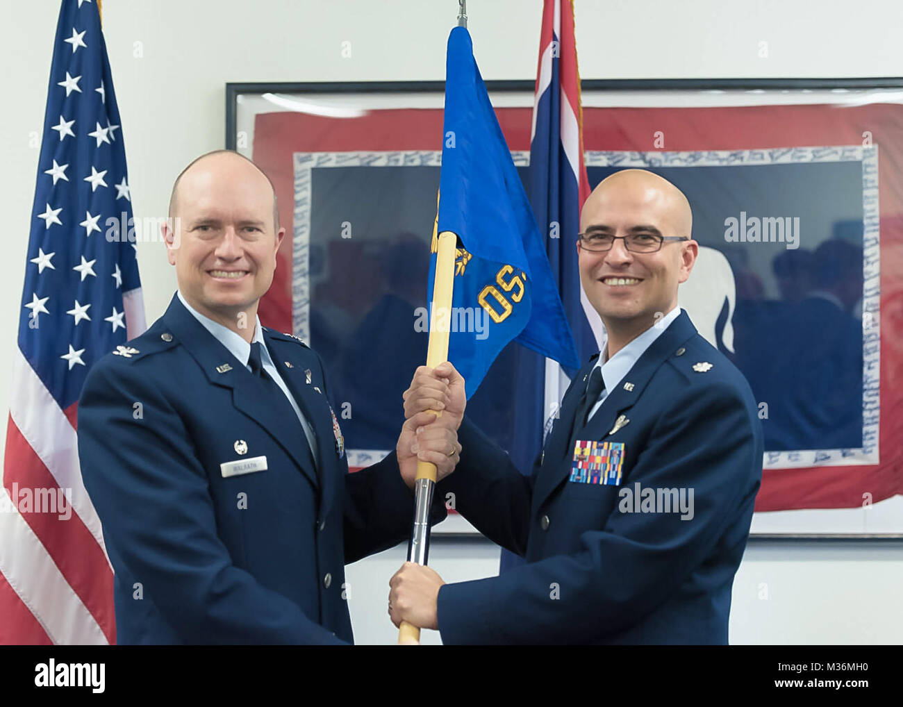 153rd Operations Group Commander Col. Justin Walrath passes the ...