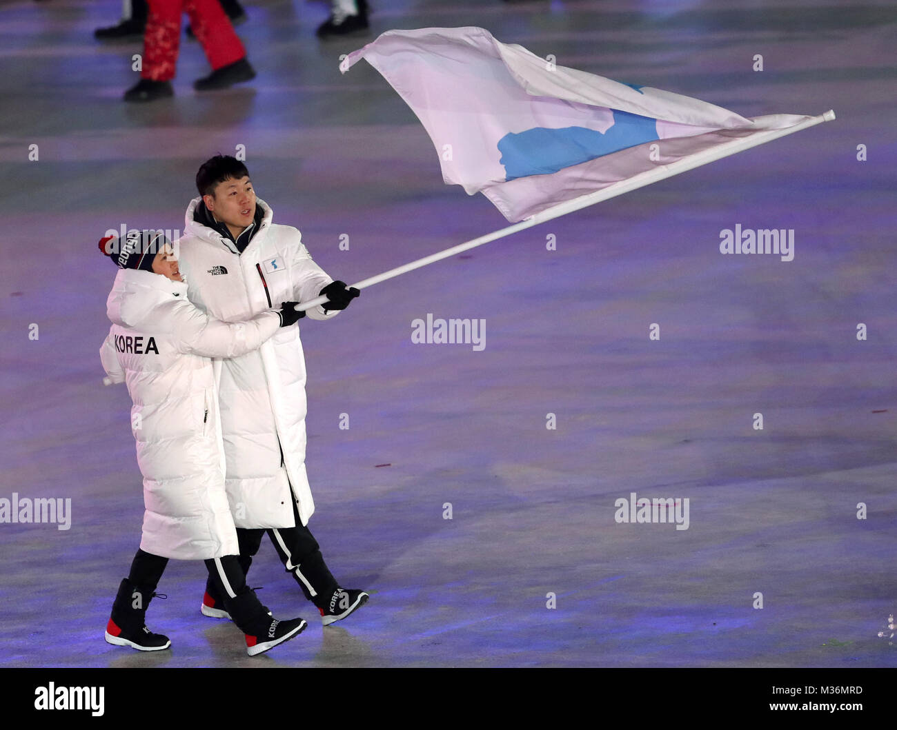 North and South Korea flag-bearers Chung Gum Hwang and Yunjong Won ...