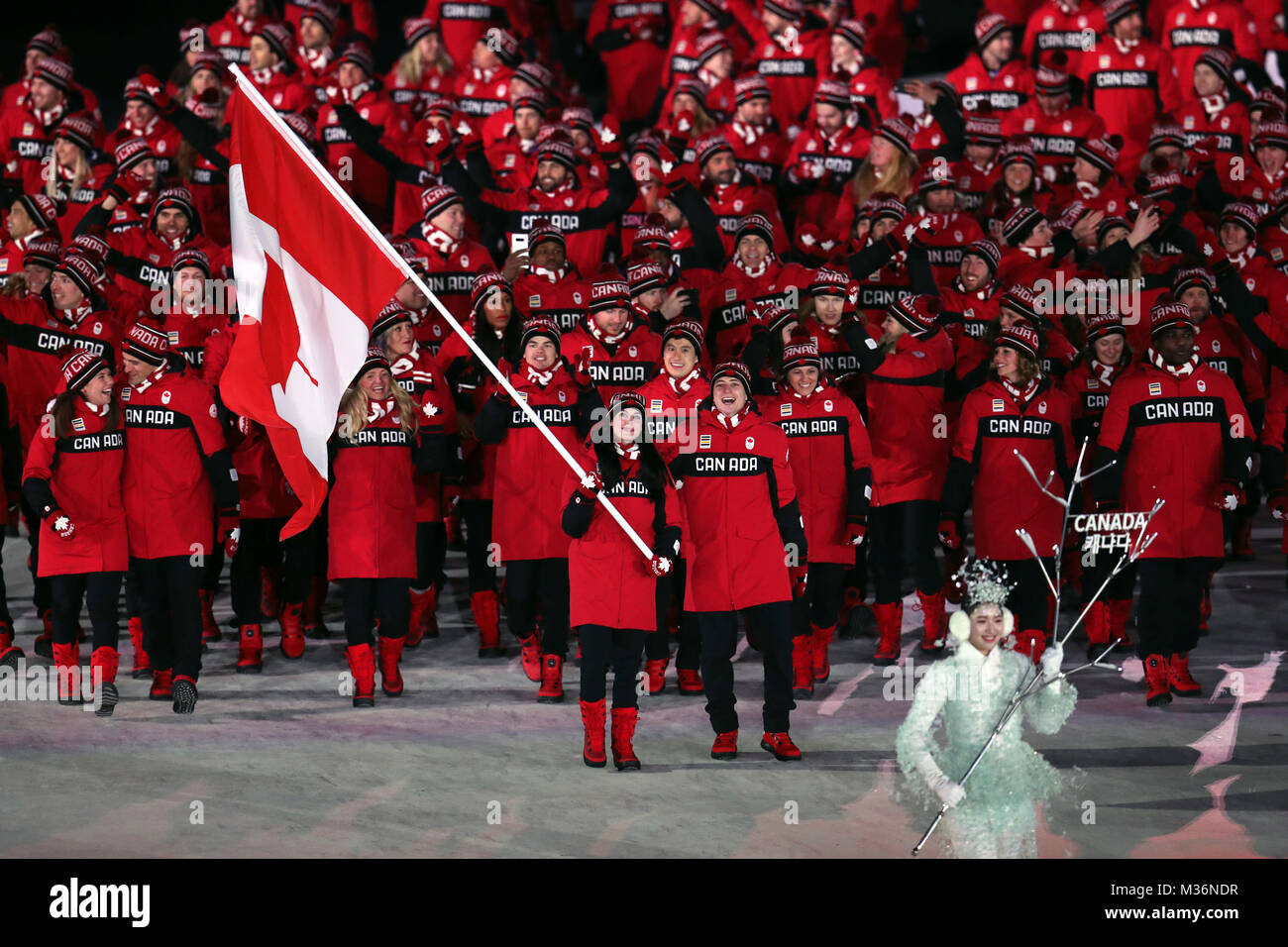 Canada's flag bearers Tessa Virtue and Scott Muir lead of the team ...