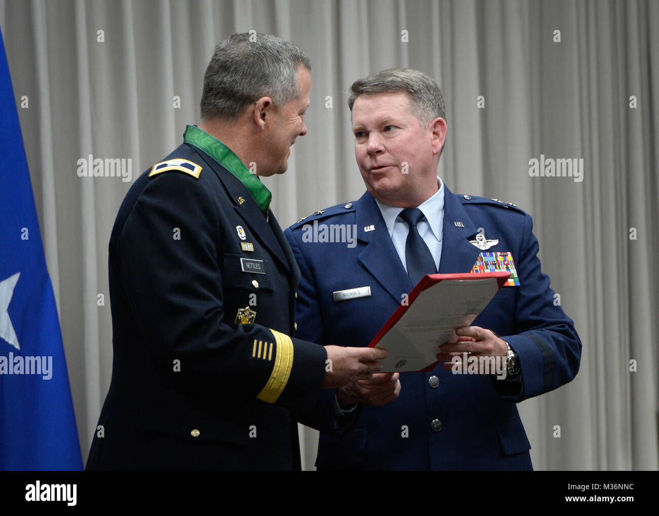 Army Col. Adrian Bentley Nettles (left) visits with Air Force Maj. Gen ...