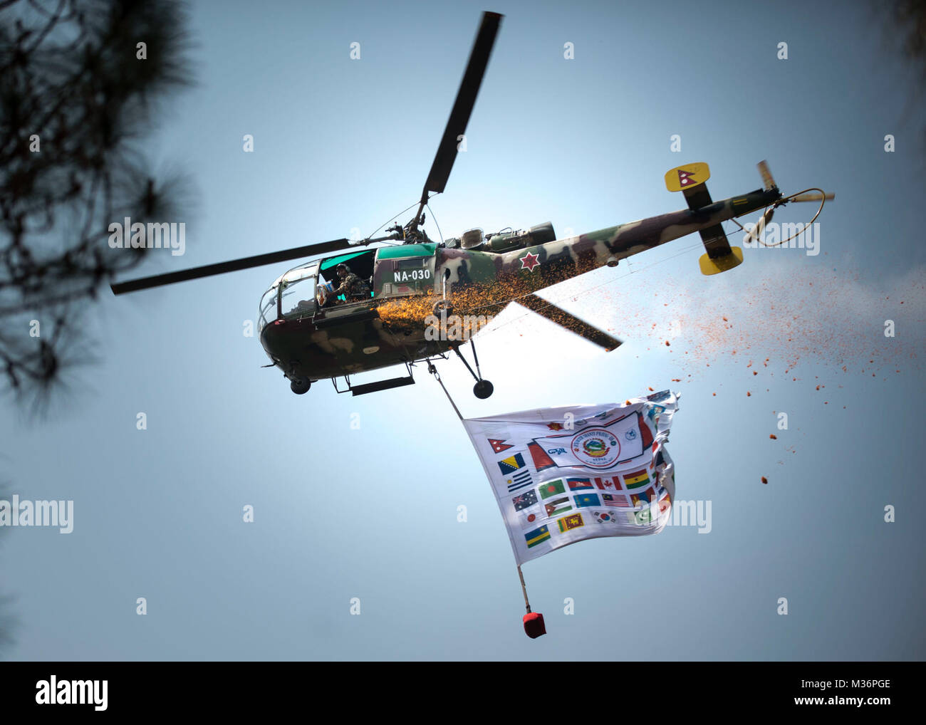 A helicopter does a fly-by dropping flower petals and displaying the ...