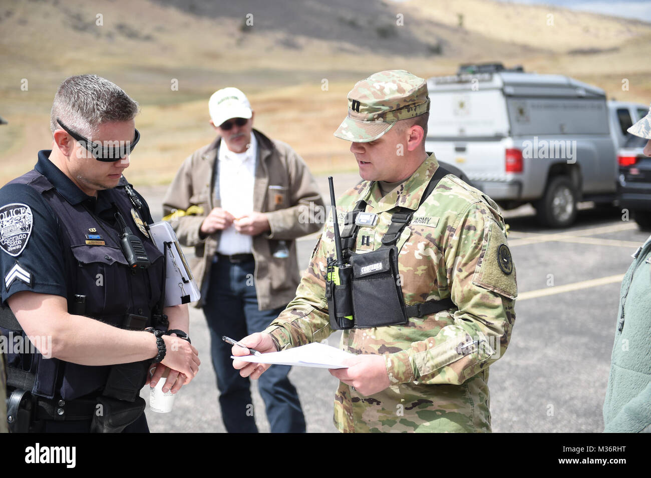 CST member Capt. Adam Oswalt debriefs Corporal Jamie Royroux of the CSU ...