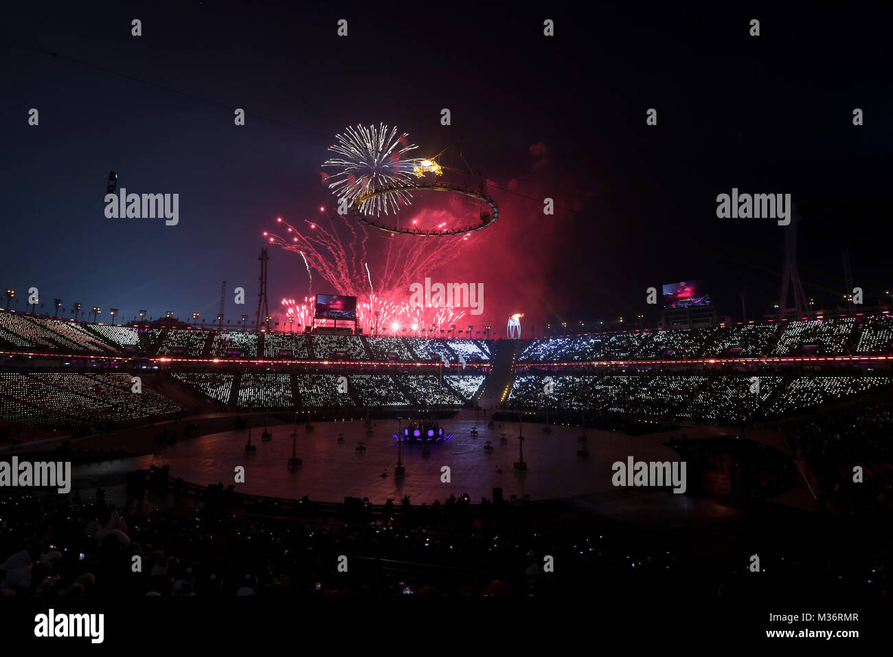 Fireworks are set off as the Olympic torch is lit during the Opening ...