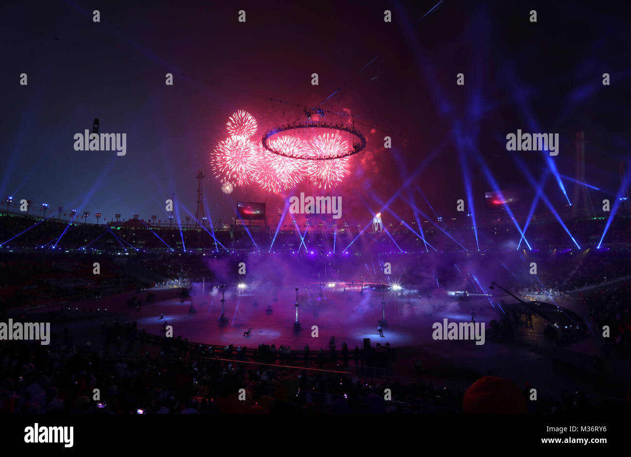 Fireworks are set off as the Olympic torch is lit during the Opening ...
