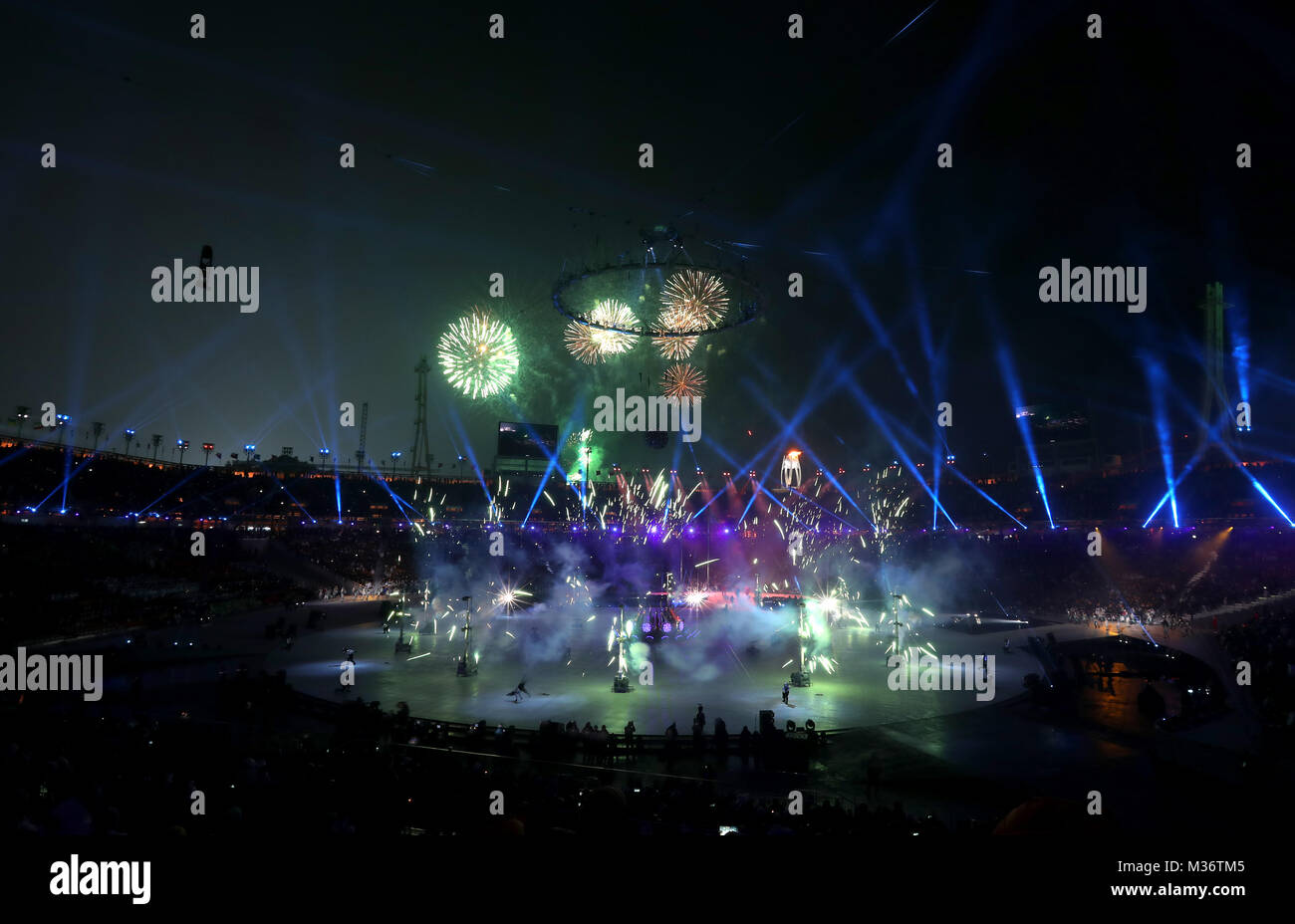 Fireworks are set off as the Olympic torch is lit during the Opening ...
