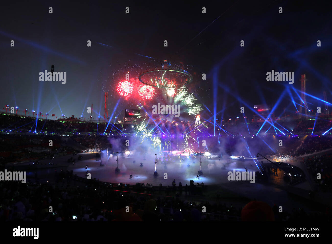 Fireworks are set off as the Olympic torch is lit during the Opening ...