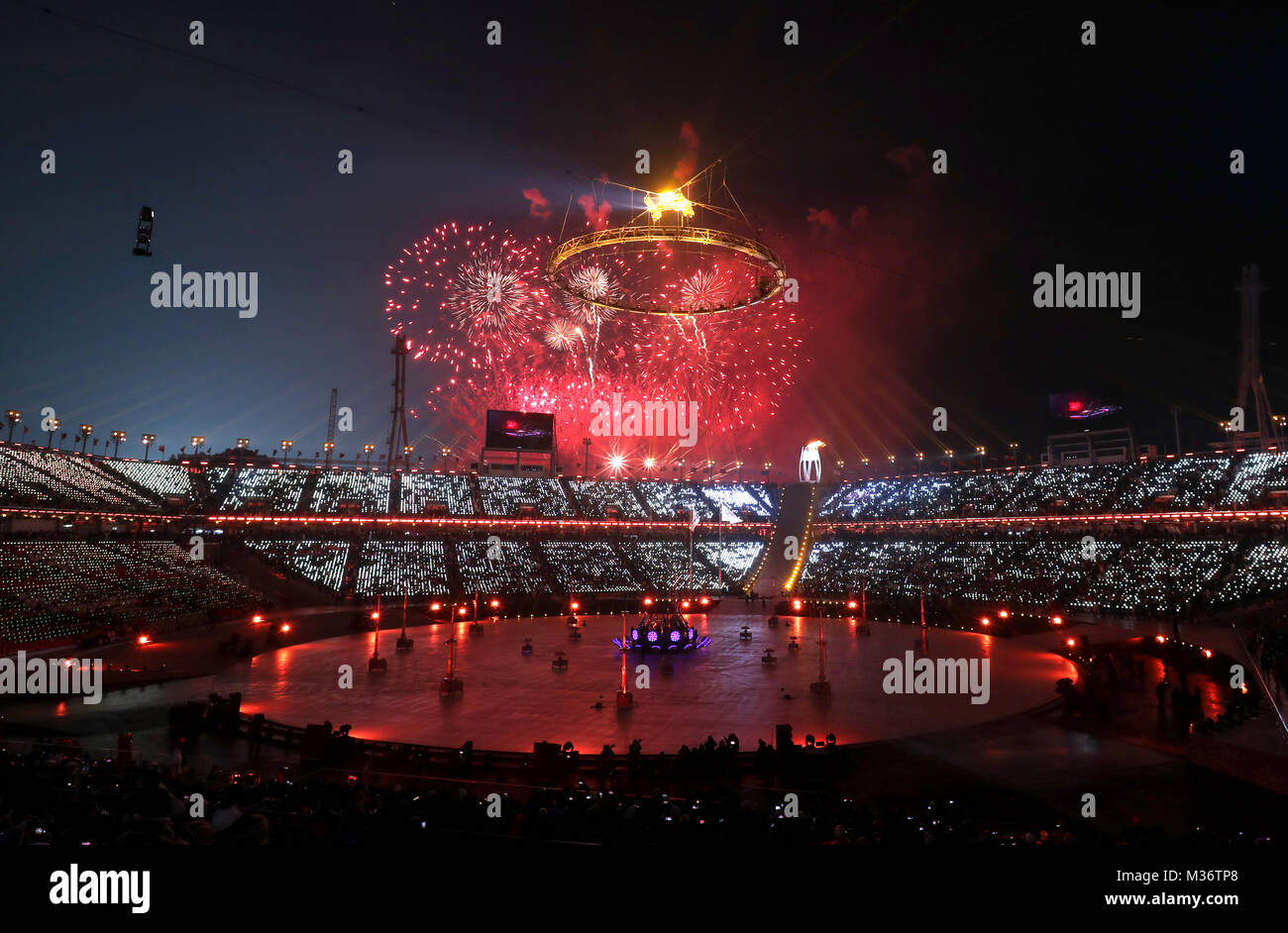 Fireworks are set off as the Olympic torch is lit during the Opening ...
