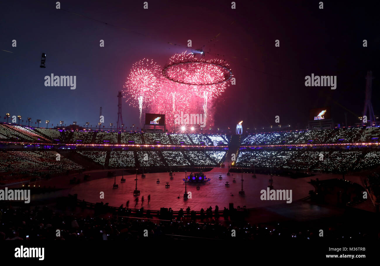 Fireworks are set off as the Olympic torch is lit during the Opening ...