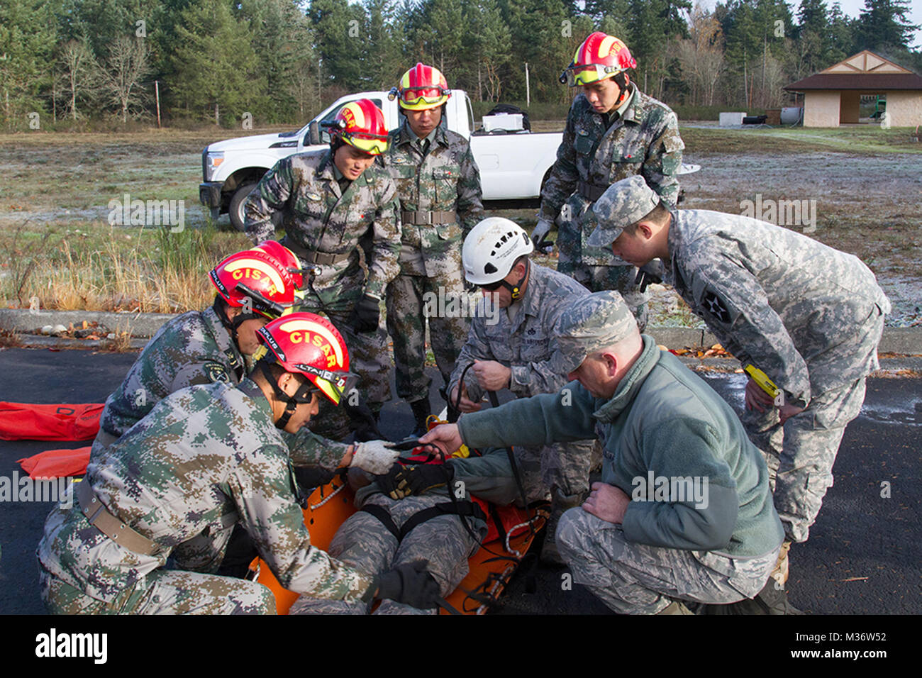 Service members from the U.S. Army and U.S. Air Force demonstrate ways ...