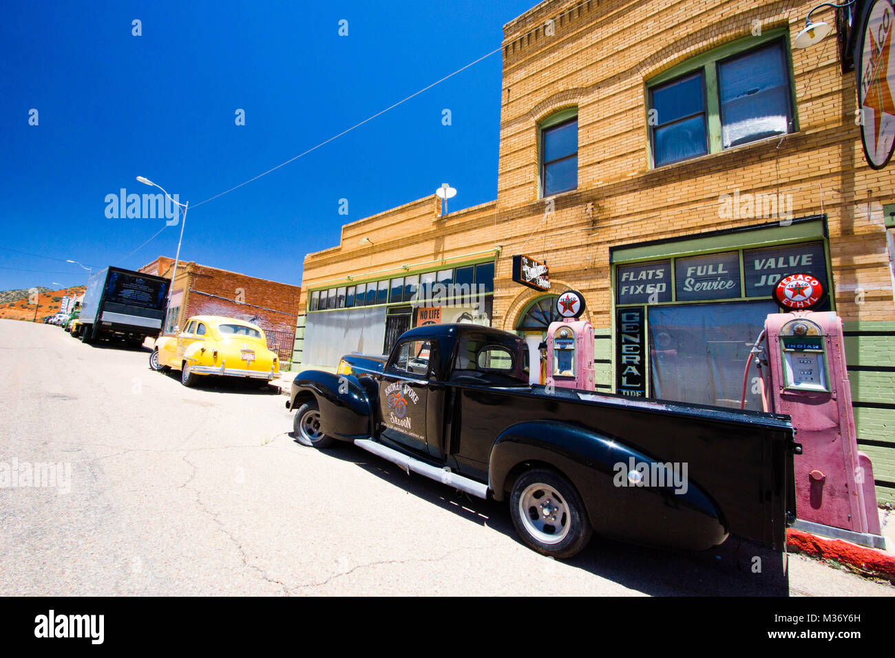 classic old American pick-up truck on an old small-town street in ...