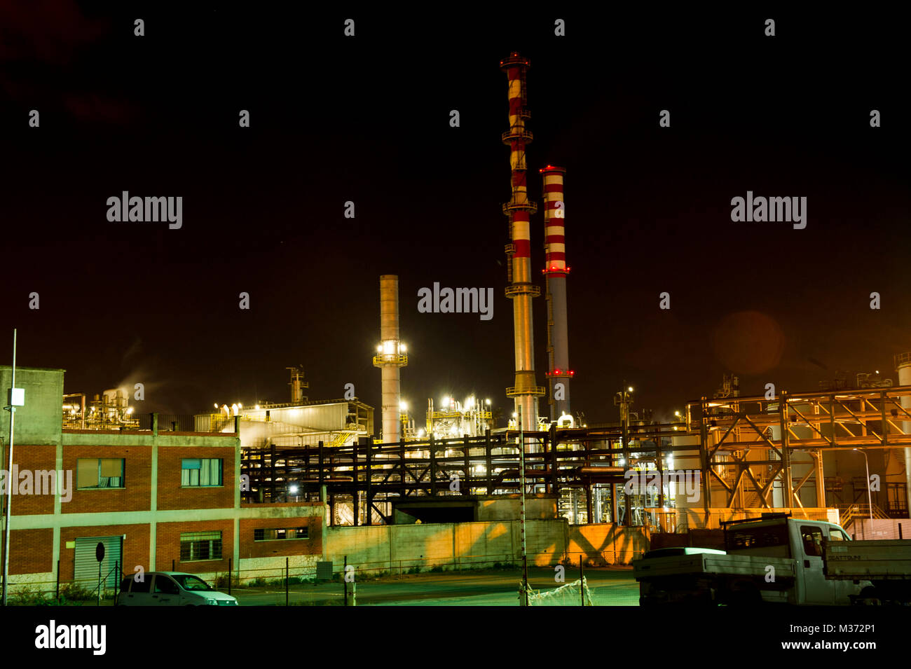 Taranto thermal power plant eni by night hi-res stock photography and ...