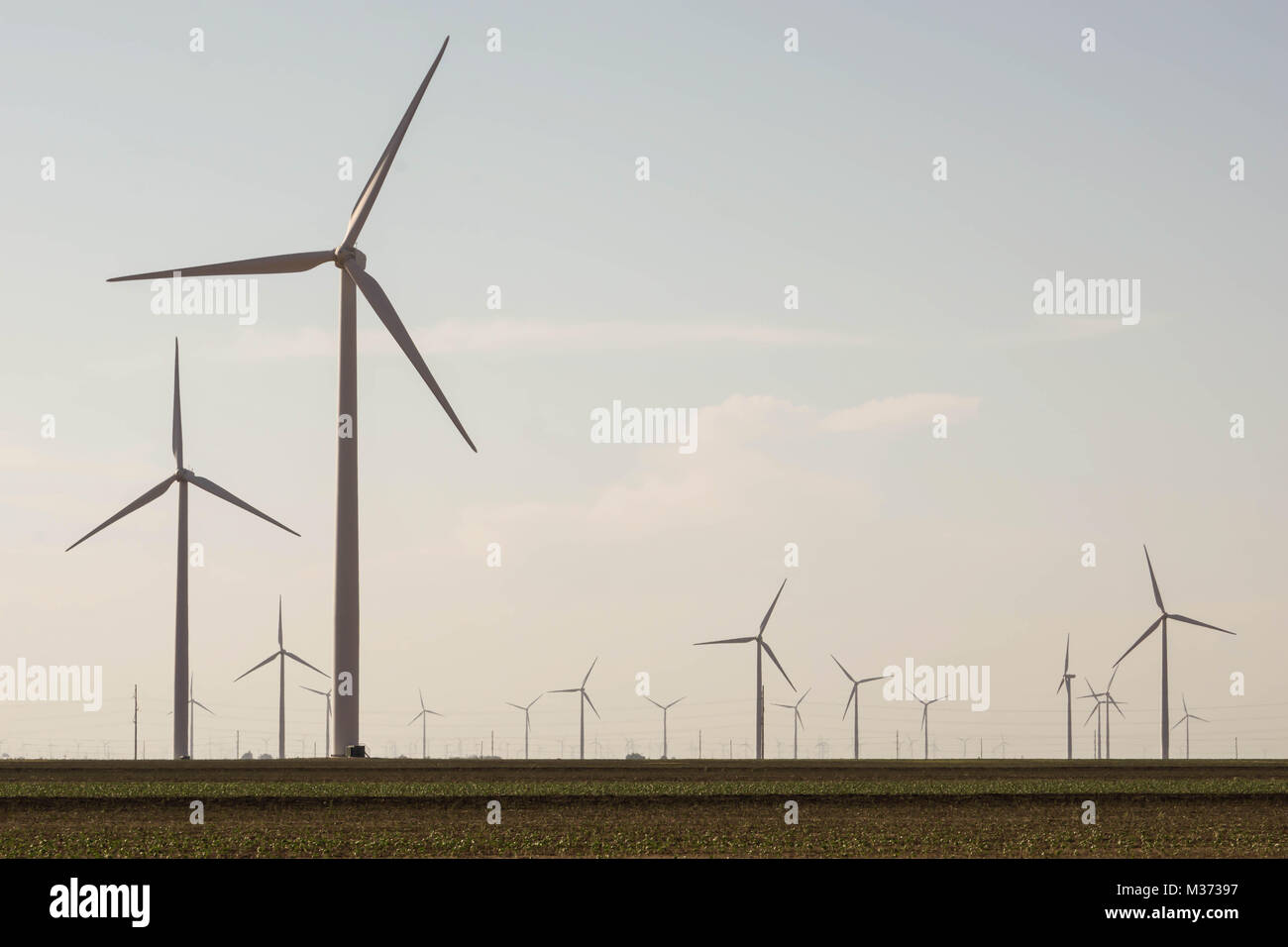 large white wind turbines on wind farm in the Texas Panhandle plains ...