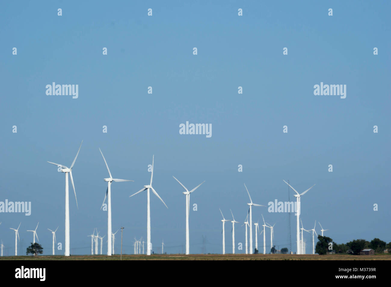 large white wind turbines on wind farm in the Texas Panhandle plains ...