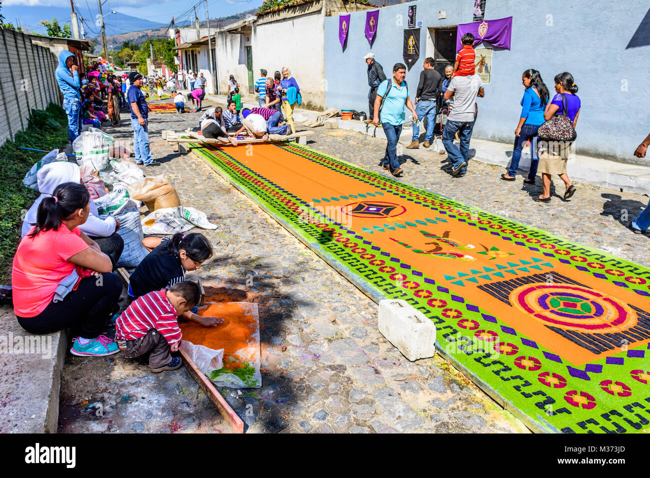 Antigua, Guatemala - March 6, 2016: Locals decorate dyed sawdust Lent ...