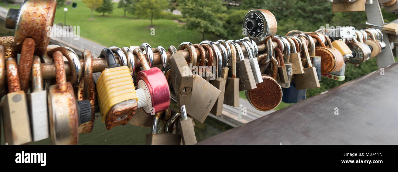 many padlocks and locks in different shapes and sizes locked onto a ...