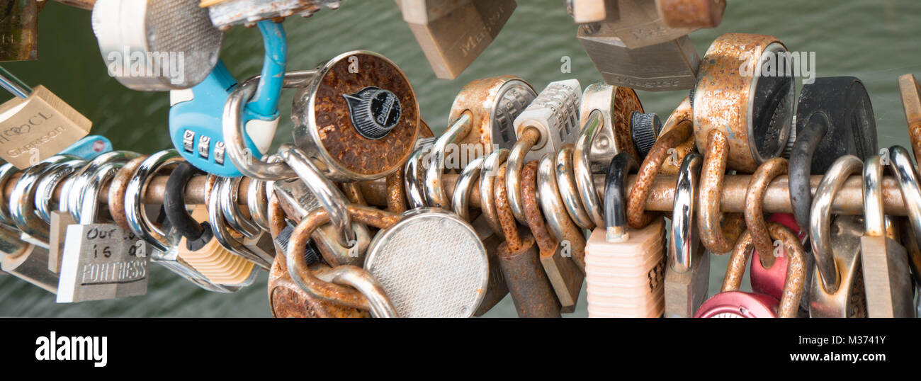 many padlocks and locks in different shapes and sizes locked onto a ...