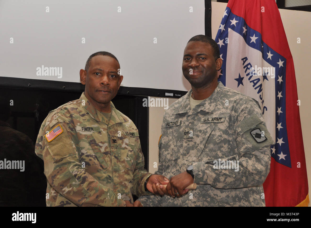 Officer Candidate Fletcher (right) receives his completion certificate ...