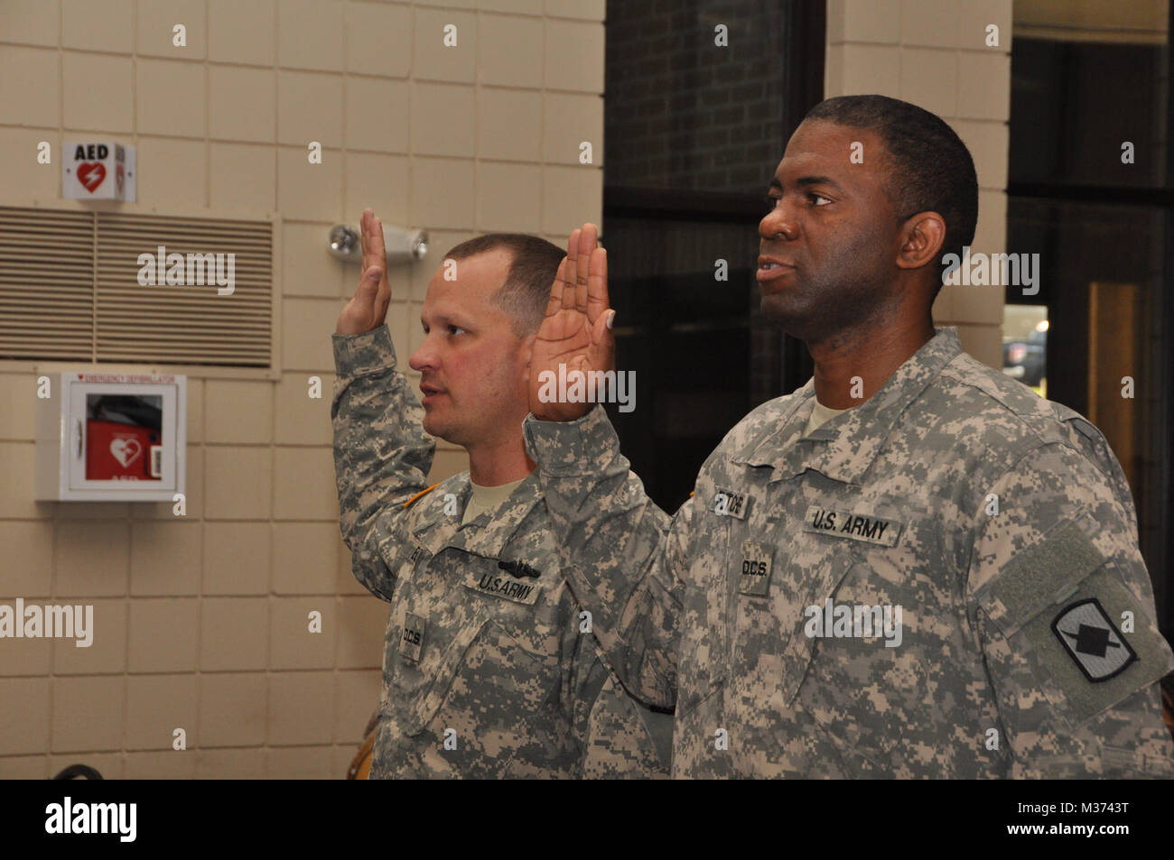 Officer Candidates Egnew (left) and Fletcher (right) recite the oath of ...