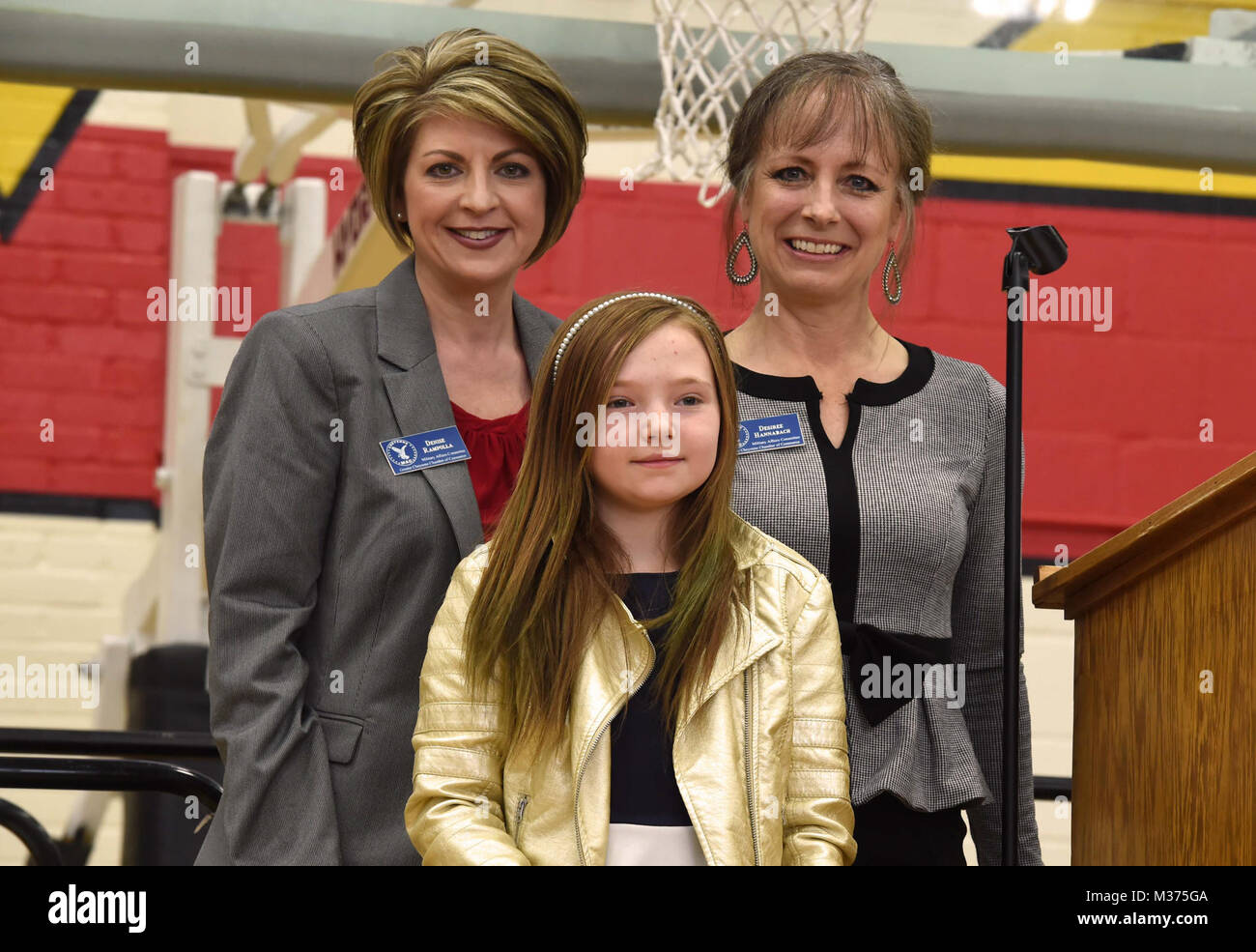 Fourth grader Lane Bybee receives her first place prize from Greater ...