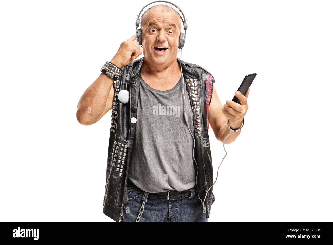 Old punker listening to music on a phone isolated on white background ...