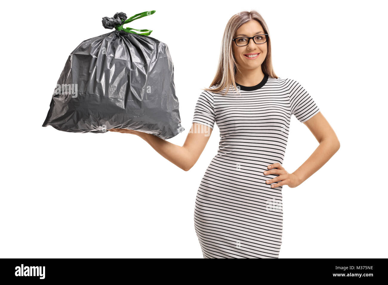 Young woman holding a garbage bag isolated on white background Stock ...