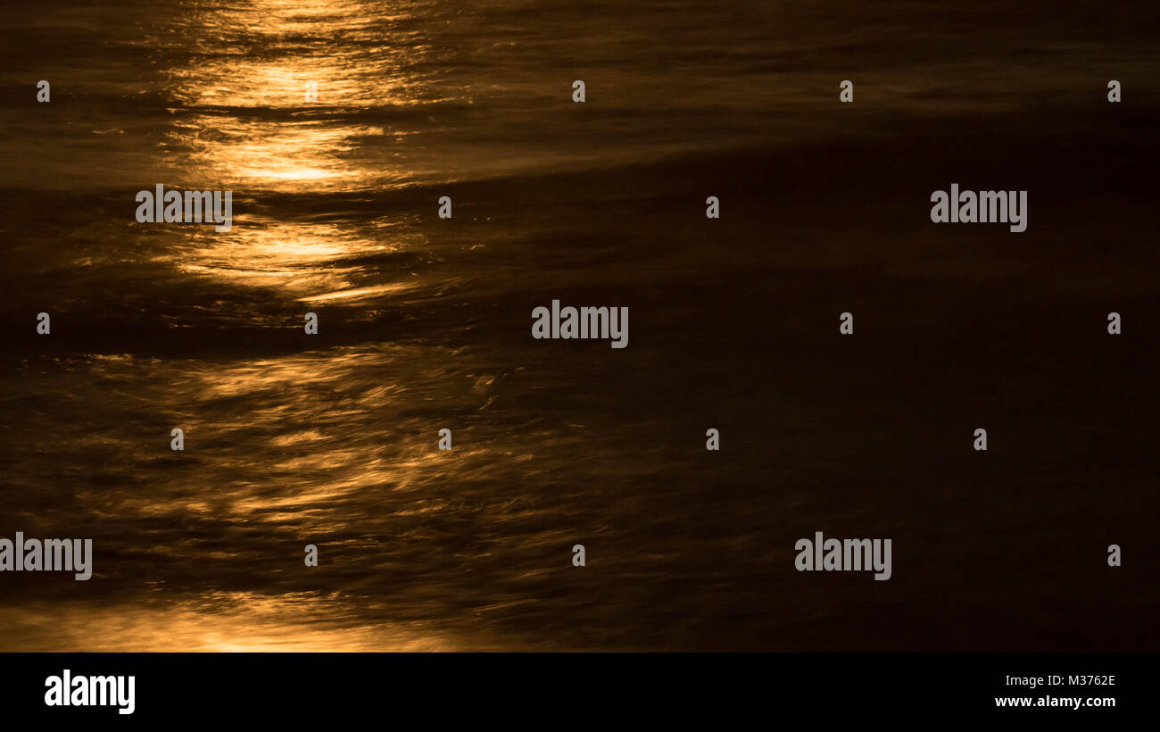 abstract background view of a beautiful full moon rising over a ...