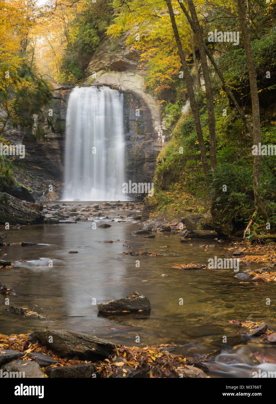 Looking Glass waterfall and creek in late fall with gorgeous autumn ...