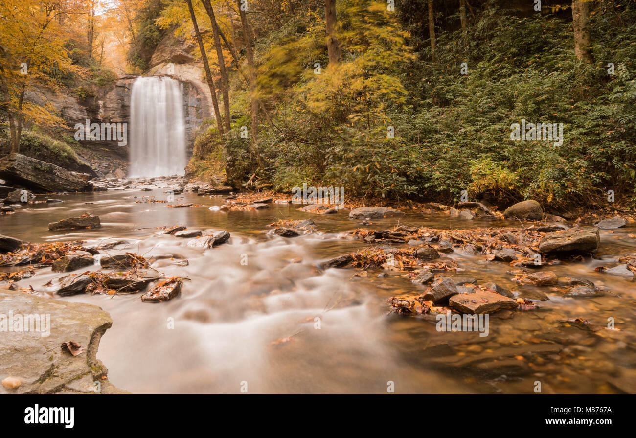 Looking Glass waterfall and creek in late fall with gorgeous autumn ...
