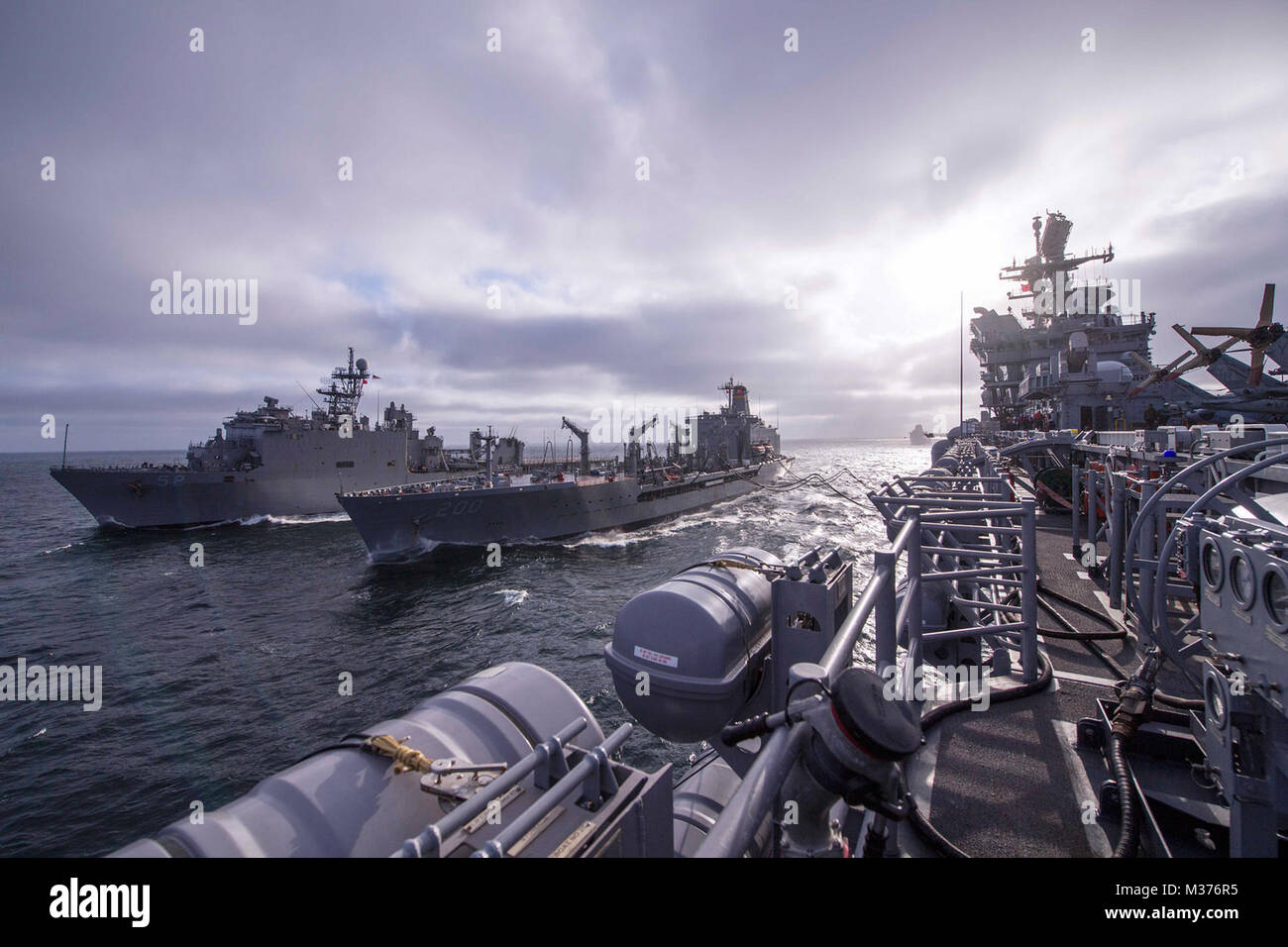 USS America, USS Pearl Harbor conduct replenishment with USNS Guadalupe ...