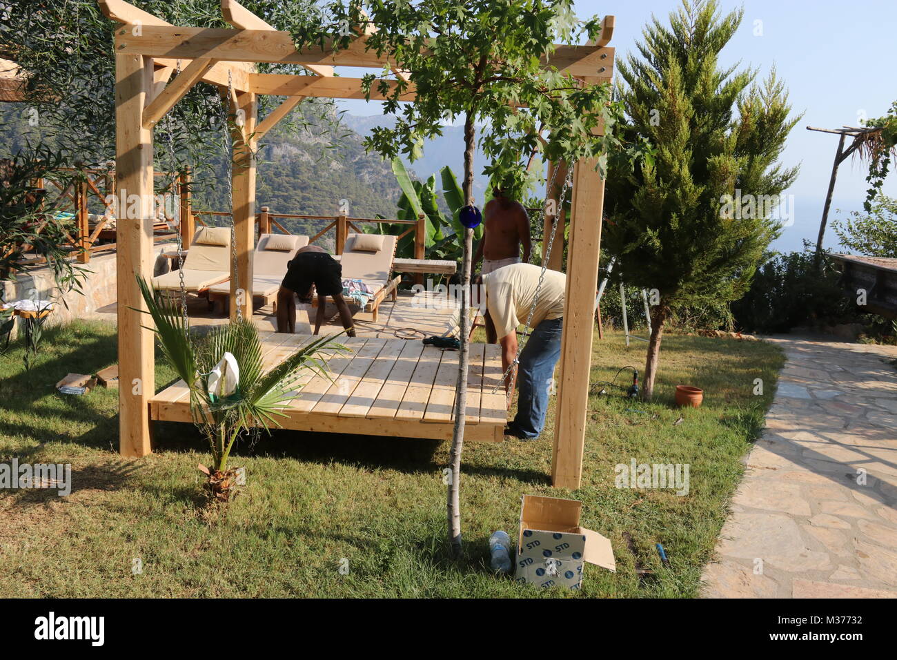 20TH JULY 2017, KABAK,TURKEY: Turkish workmen building a swing seat ...